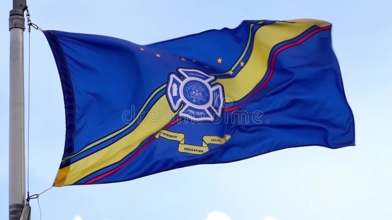 A Calgary Fire Department Flag Waving with the Wind in Slow-motion ...