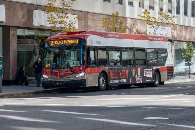 Calgary Transit Bus Waiting at a Bus Stop Editorial Photography - Image ...