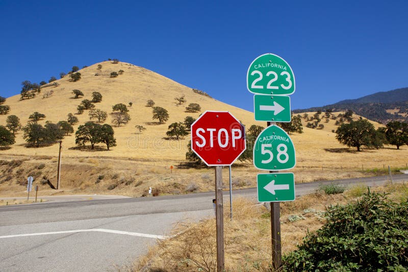 California Road Signs at Crossroad Stock Photo - Image of trees, road ...