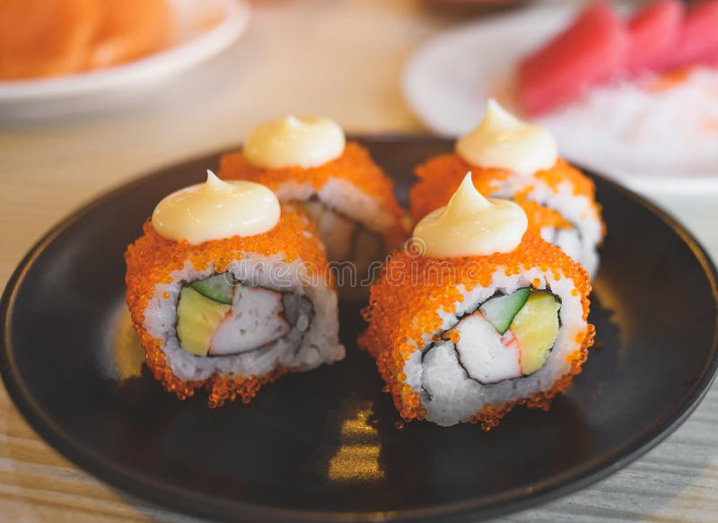 California Roll and Cut Served in Black Plate Stock Image - Image of ...