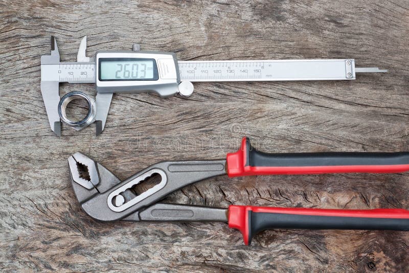 Caliper and Adjustable Wrench. Stock Photo - Image of industry ...