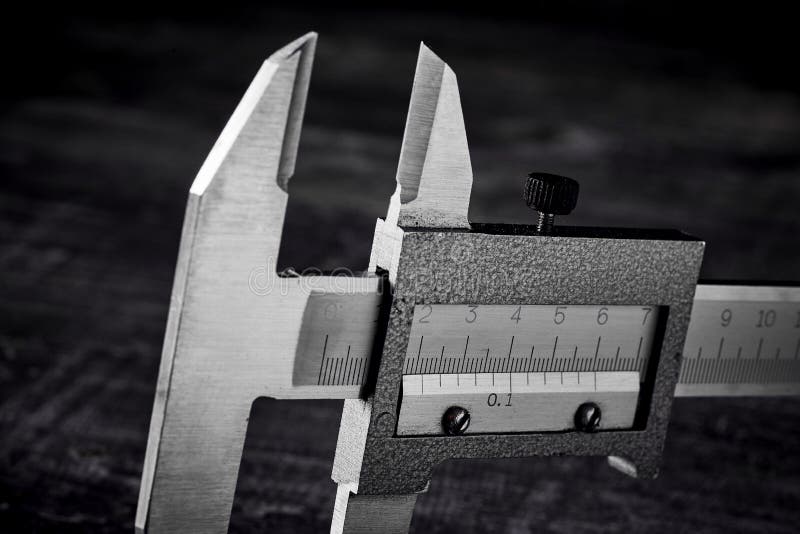 The Caliper on a Dark Wooden Background is an Accurate Manual Quality ...