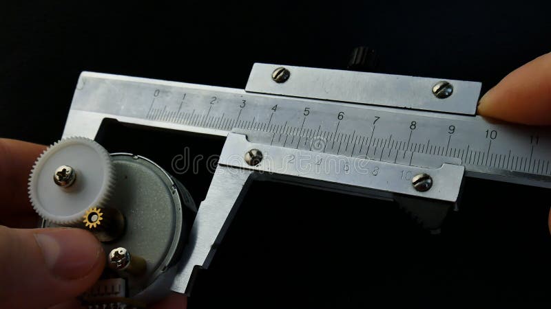 Calipers on Black Background. the Movement of Caliper. Closeup Stock ...