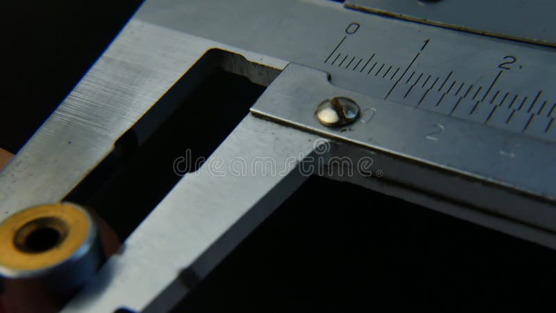 Calipers on Black Background. the Movement of Caliper. Closeup Stock ...