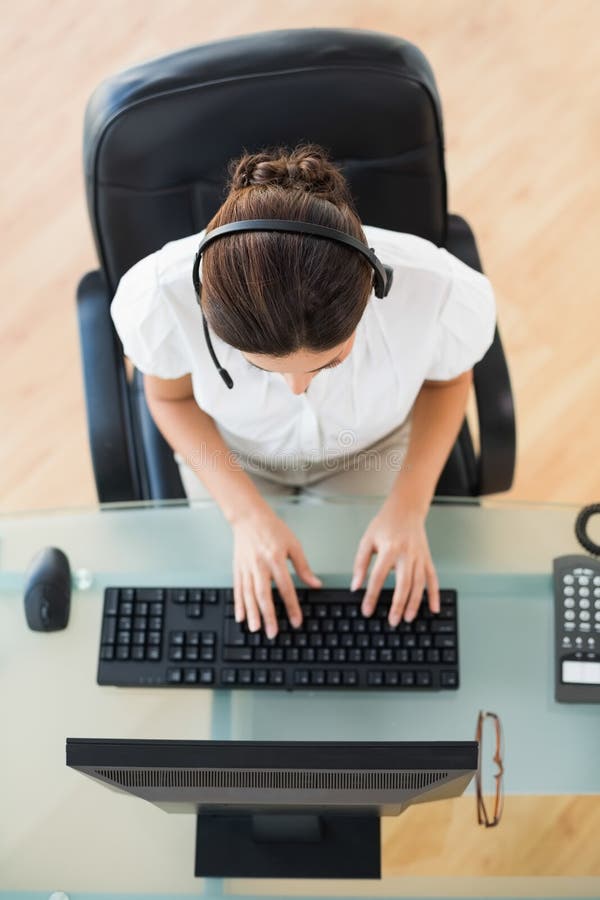 Call Center Agent Typing while on a Call Stock Photo - Image of ...