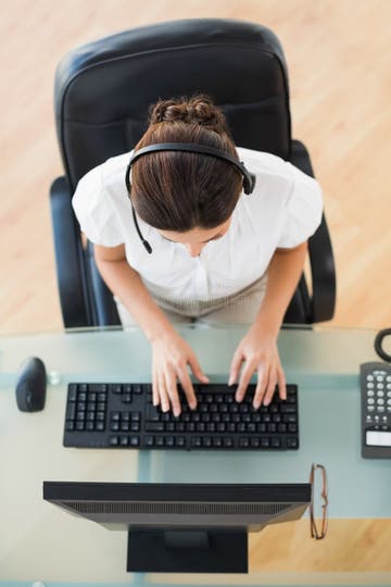 Call Center Agent Typing while on a Call Stock Photo - Image of ...