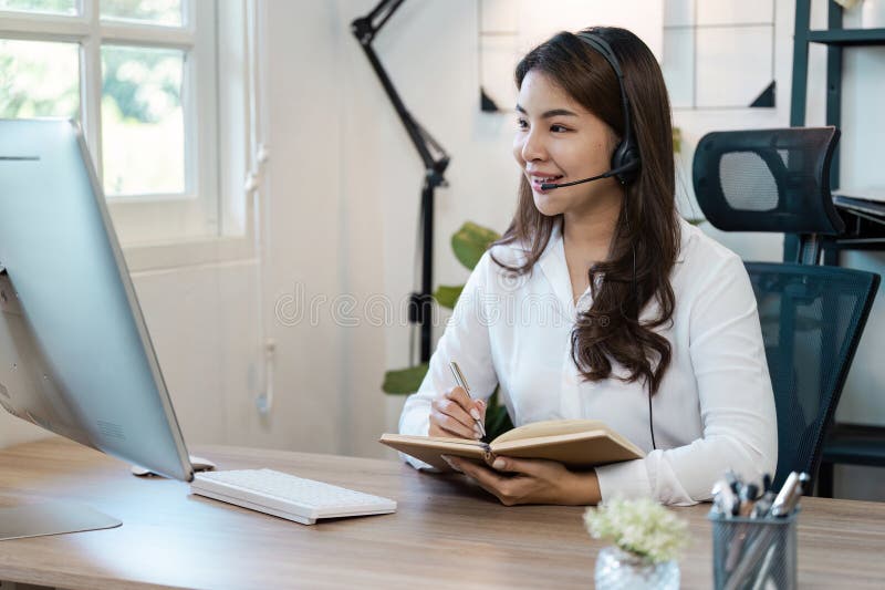 Call Center Agent Headset Taking Notes Stock Photos - Free & Royalty ...