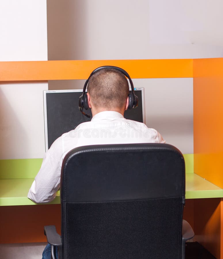 Call center agent at work stock image. Image of headset - 65973575