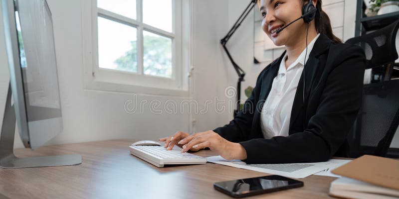 Call Center Agent Working Professionally at a Desk with a Headset and ...