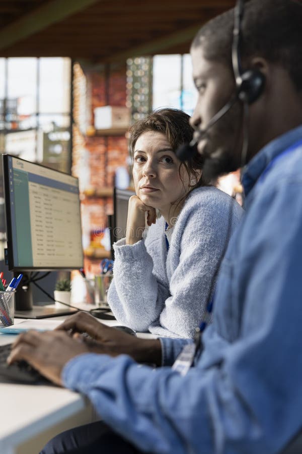 Call Center Agents Logging Customer Interactions in Spreadsheet ...