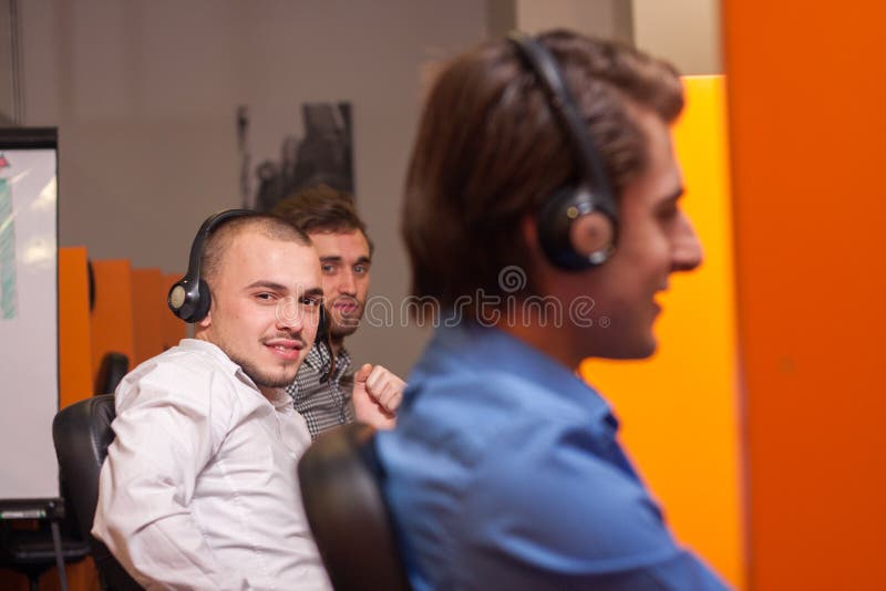 Call center agents at work stock photo. Image of service - 65972520