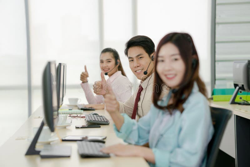 Two Call Center Workers Giving High Five To Each Other At Office Stock ...