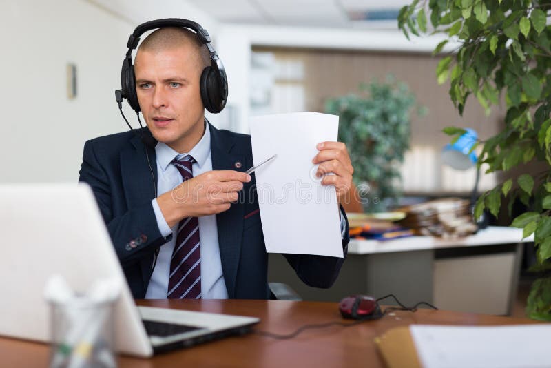 Call Center Man Operator with Headset Talking with Client in Office ...