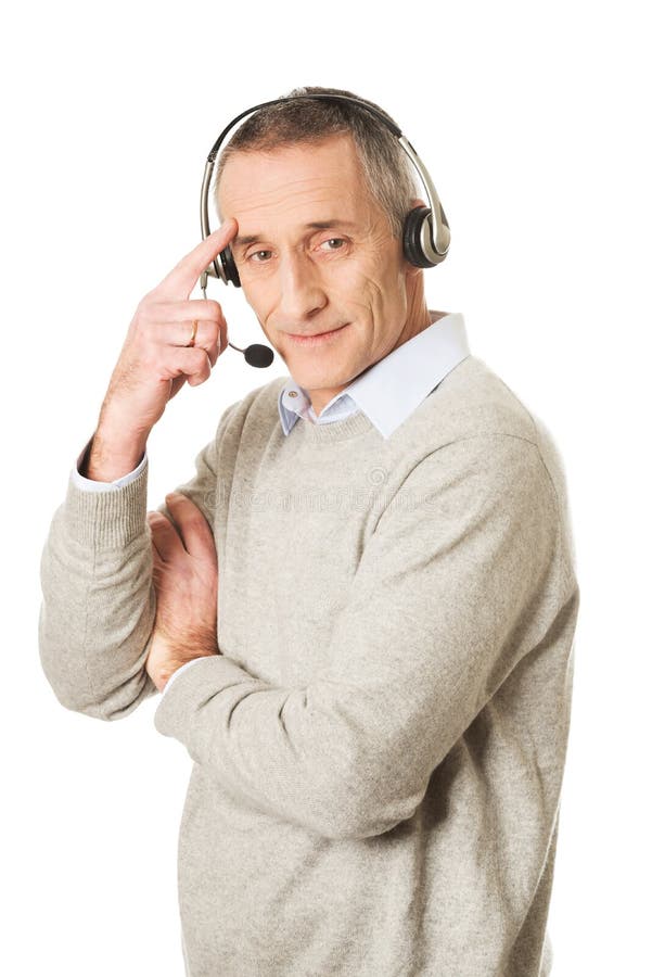 Call Center Man Wearing a Headset Touching Head Stock Photo - Image of ...