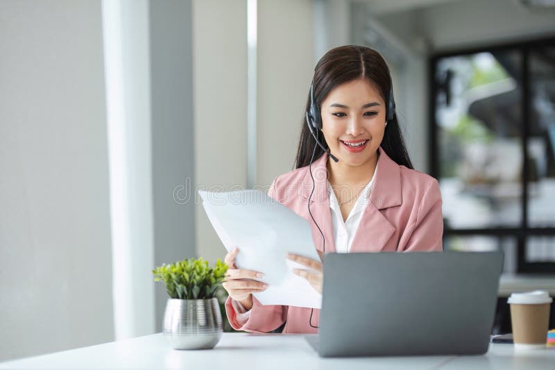 A Call Center Operator is Explaining Job Details To a Customer on a ...