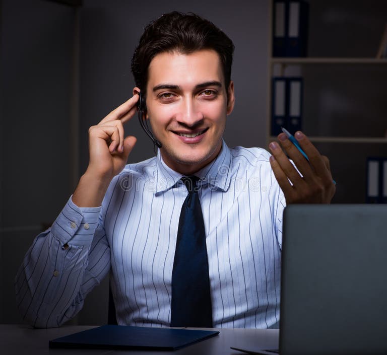 Call Center Operator Talking To Customer during Night Shift Stock Image ...