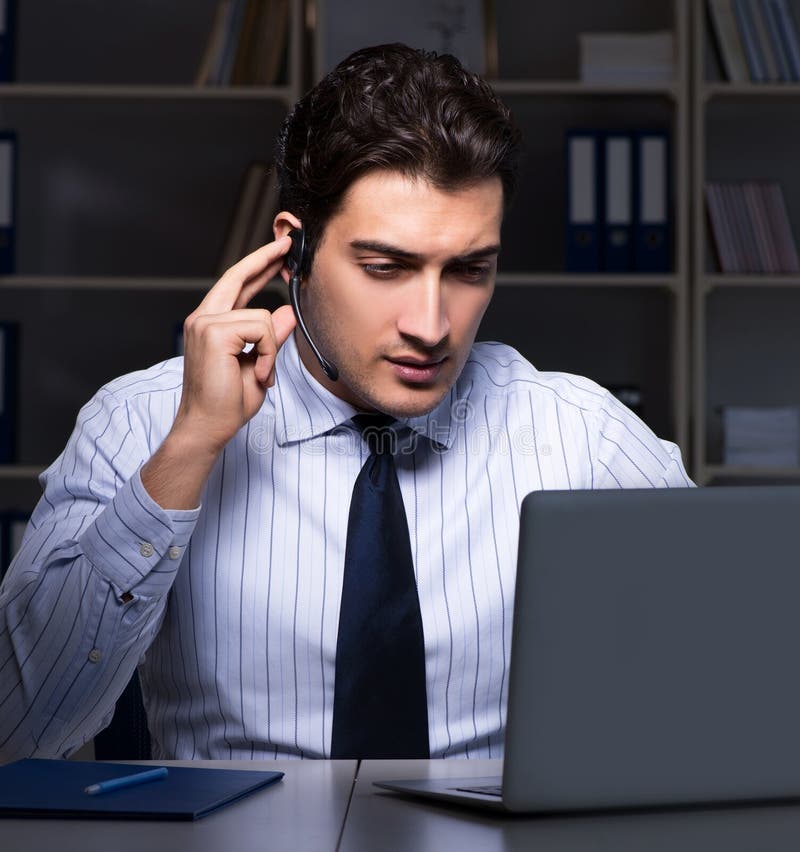 Call Center Operator Talking To Customer during Night Shift Stock Image ...