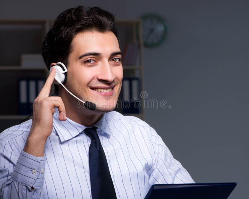 Call Center Operator Talking To Customer during Night Shift Stock Photo ...