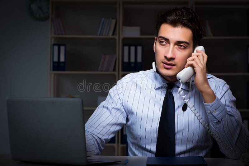 The Call Center Operator Talking To Customer during Night Shift Stock ...