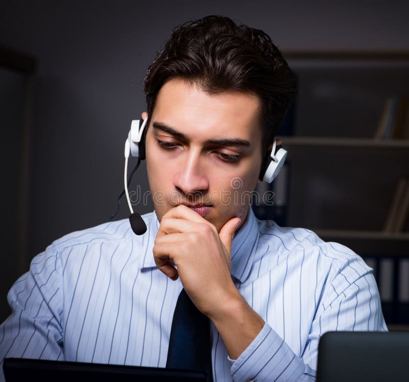 Call Center Operator Talking To Customer during Night Shift Stock Photo ...