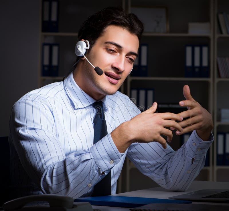 Call Center Operator Talking To Customer during Night Shift Stock Image ...
