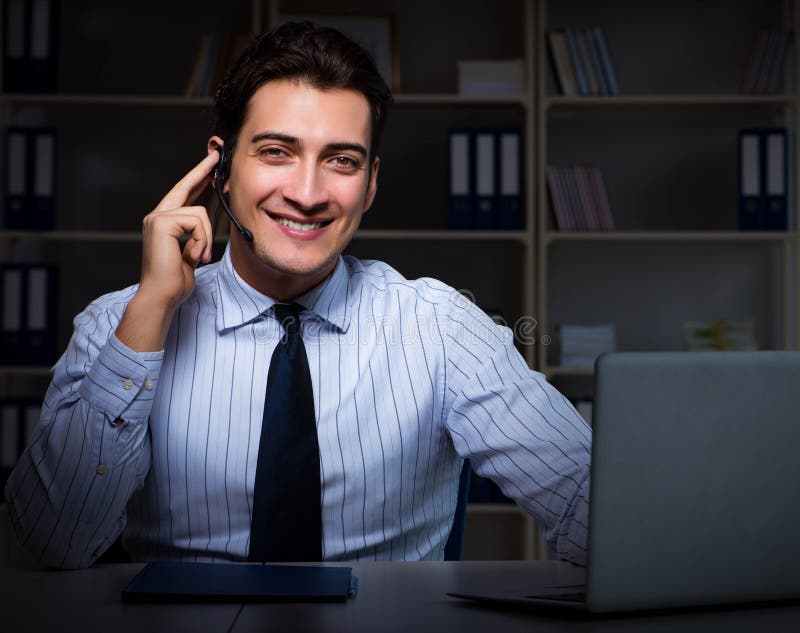 Call Center Operator Talking To Customer during Night Shift Stock Image ...