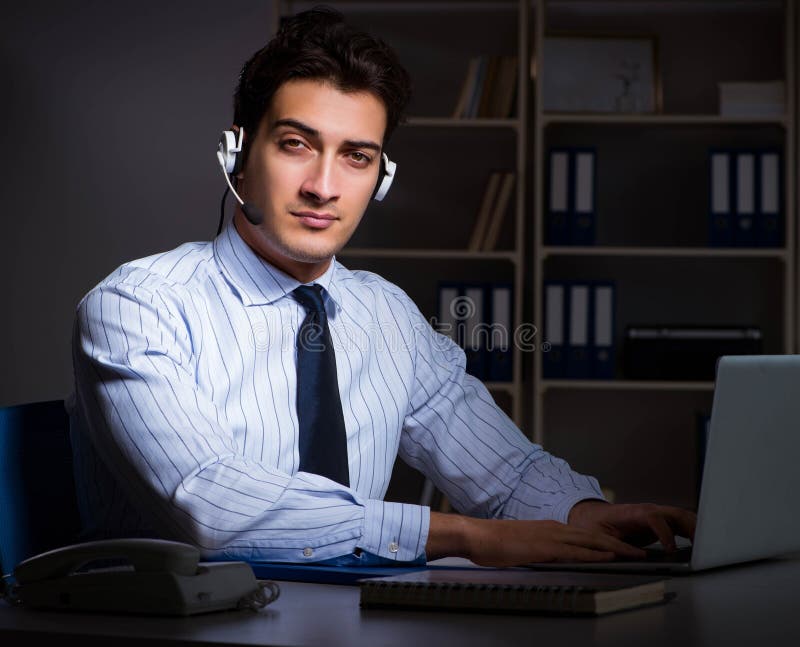 Call Center Operator Talking To Customer during Night Shift Stock Photo ...