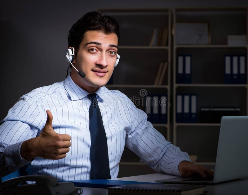 Call Center Operator Talking To Customer during Night Shift Stock Image ...