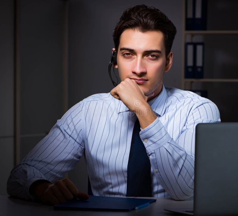 Call Center Operator Talking To Customer during Night Shift Stock Image ...
