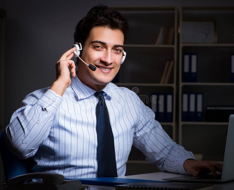 Call Center Operator Talking To Customer during Night Shift Stock Image ...