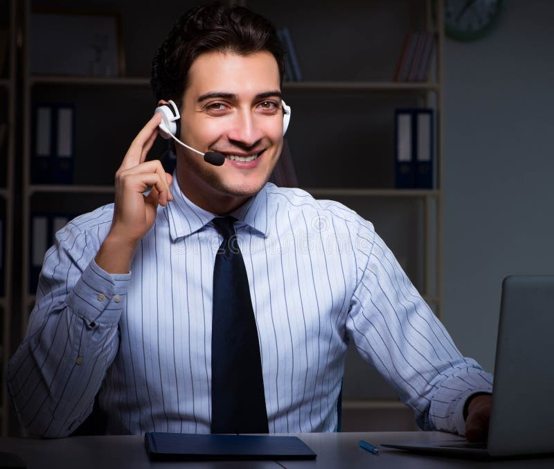 Call Center Operator Talking To Customer during Night Shift Stock Image ...