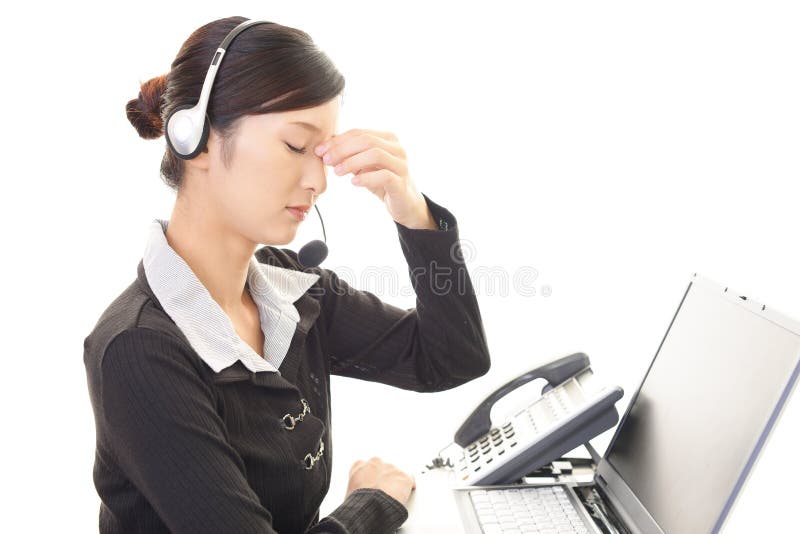 Tired call center operator stock photo. Image of businesswoman - 131101490