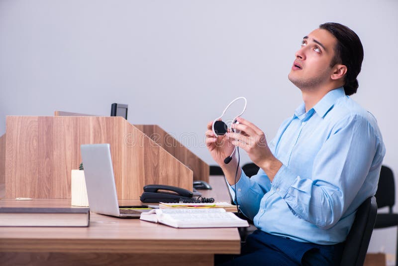 Call Center Operator Working at His Desk Stock Photo - Image of ...