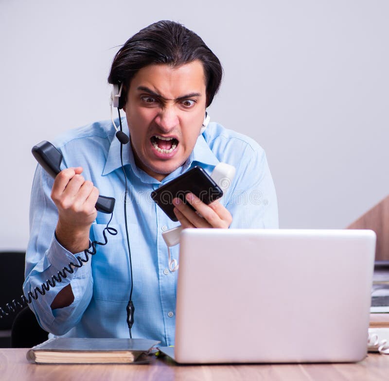 Call Center Operator Working at His Desk Stock Photo - Image of ...