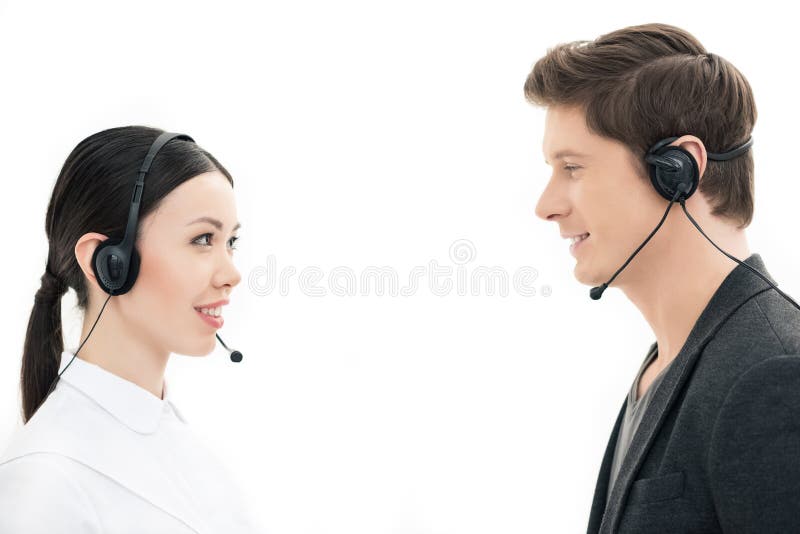Call Center Operators in Headsets Looking at Each Other Stock Image ...