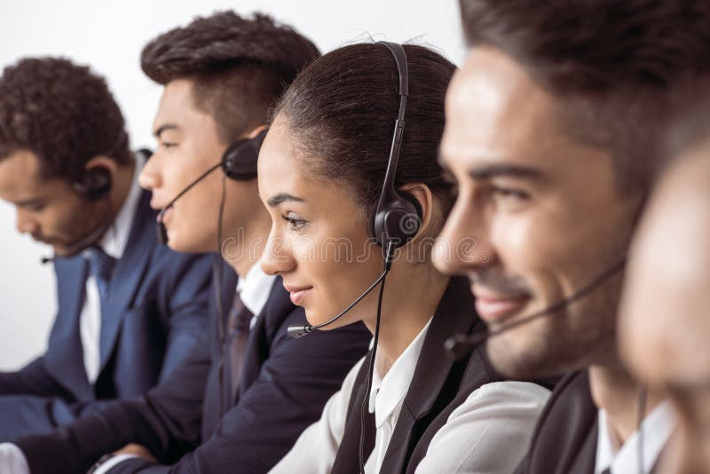Call Center Operators in Headsets Working Together Stock Photo - Image ...