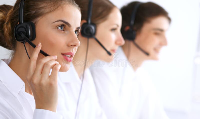 Call Center Operators at Work. Focus at Beautiful Business Woman in ...