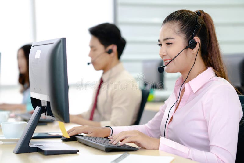 Call Center Worker Accompanied by Her Team Stock Image - Image of ...