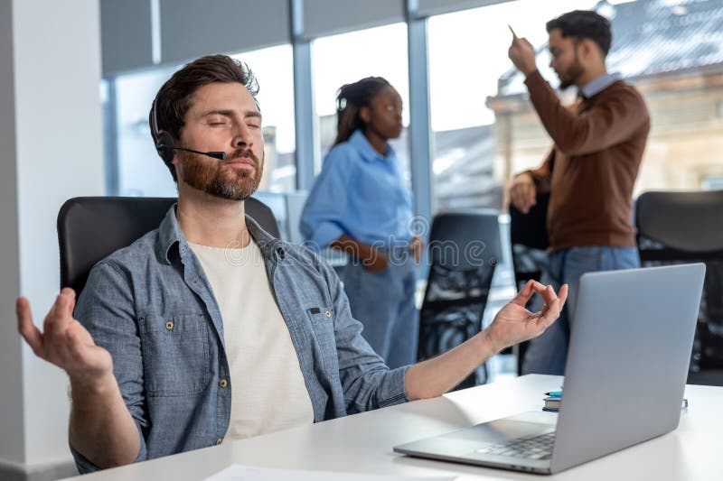 Call Center Worker with Headset Meditating at His Workplace Stock Photo ...