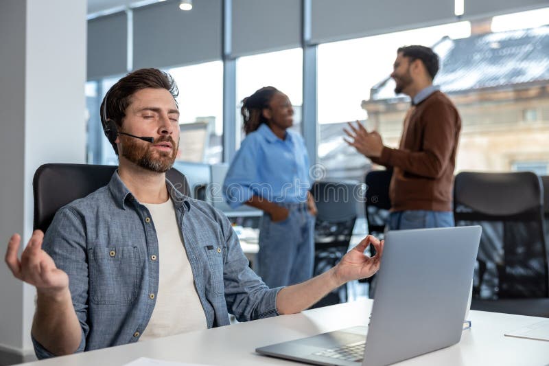 Call Center Worker with Headset Meditating at His Workplace Stock Image ...