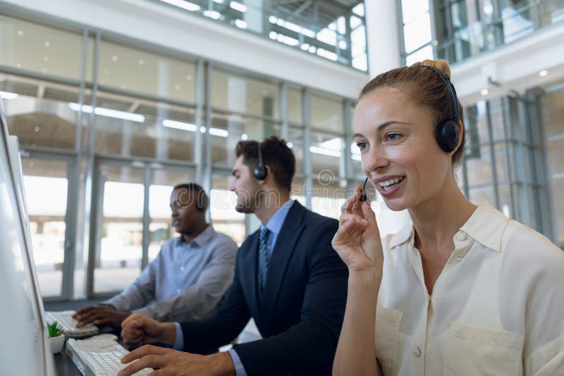Call Centre Agents Working in Open Plan Office Stock Photo - Image of ...