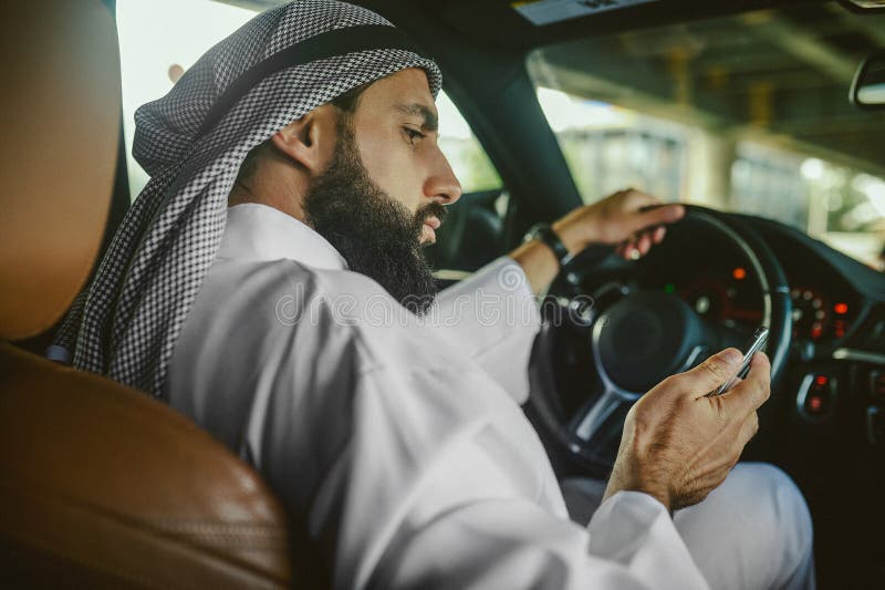 Saudi Man Sitting in a Car and Talking on the Phone Stock Image - Image ...