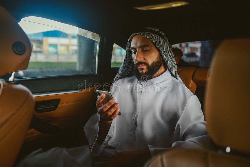 Saudi Man Sitting in a Car and Talking on the Phone Stock Image - Image ...