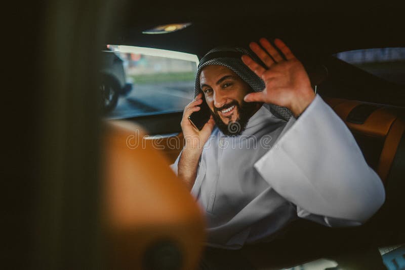 Saudi Man Sitting in a Car and Talking on the Phone Stock Image - Image ...
