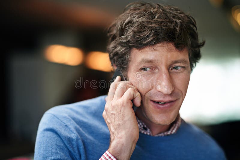 Calling a Client. a Businessman Using His Cellphone at Work in an ...