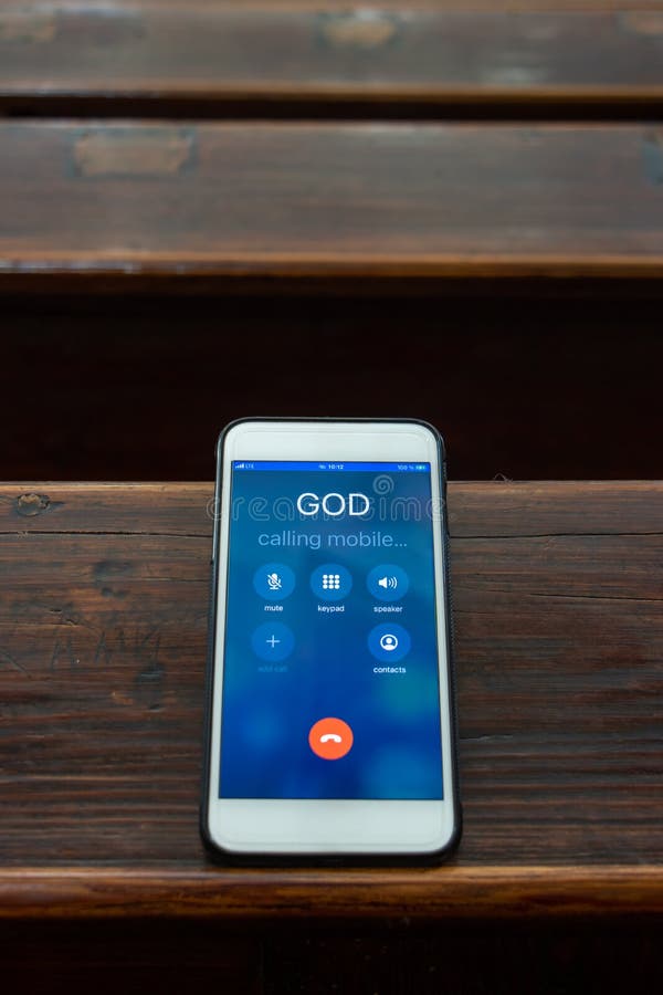 Calling God with a Mobile Phone on the Table of a Prayer Bench in the ...