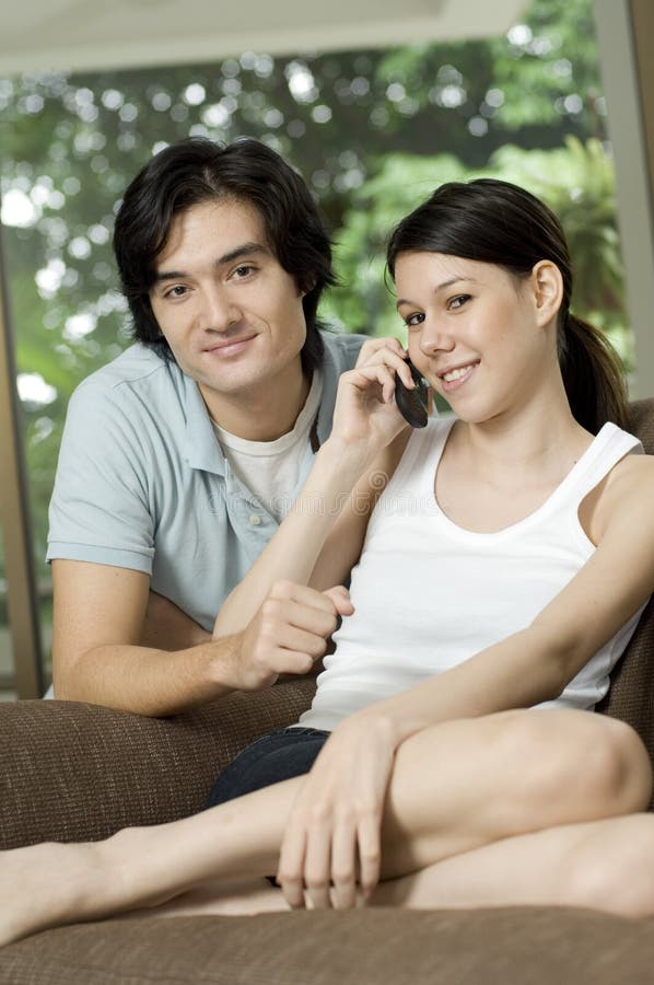 Calling from Home stock image. Image of young, sofa, phone - 1777643