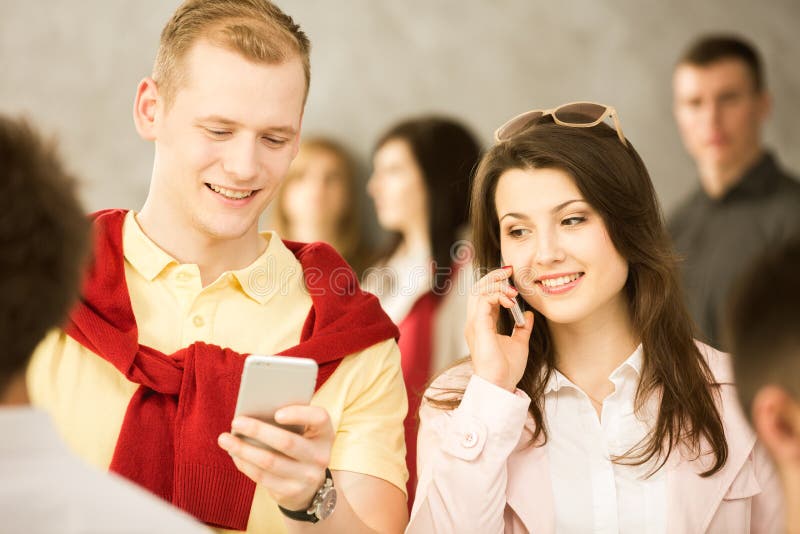 Calling their friends stock image. Image of tech, smiling - 73967871