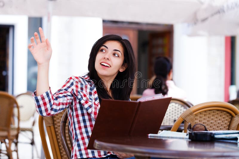 Calling for waiter stock image. Image of sitting, beautiful - 41353375