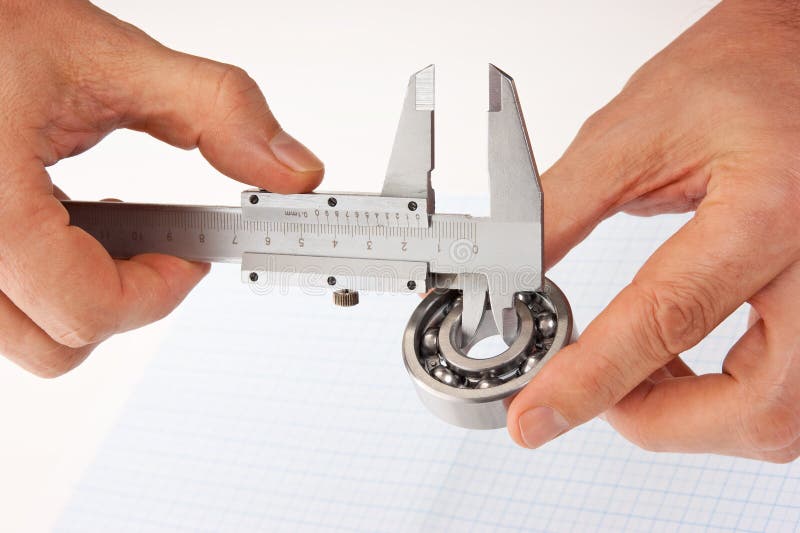 Callipers with Bearing in Hand Stock Photo - Image of engineer ...